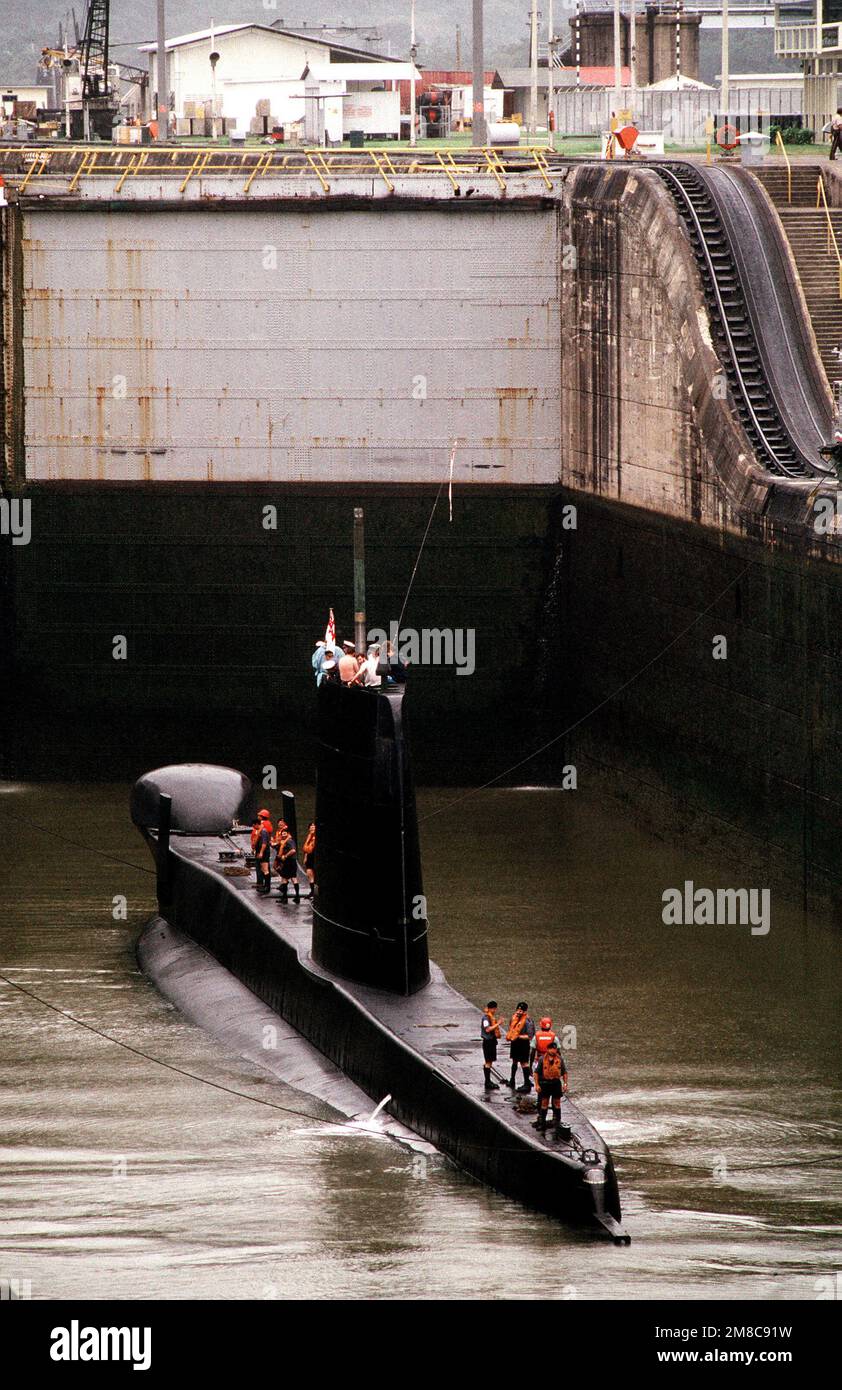 Crewmen stand on the deck of the British patrol submarine HMS OCELOT (S ...