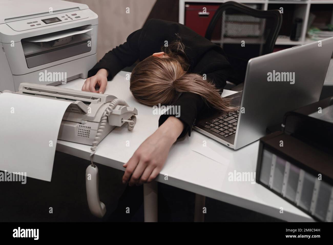 Tired overworked businesswoman table hi-res stock photography and ...