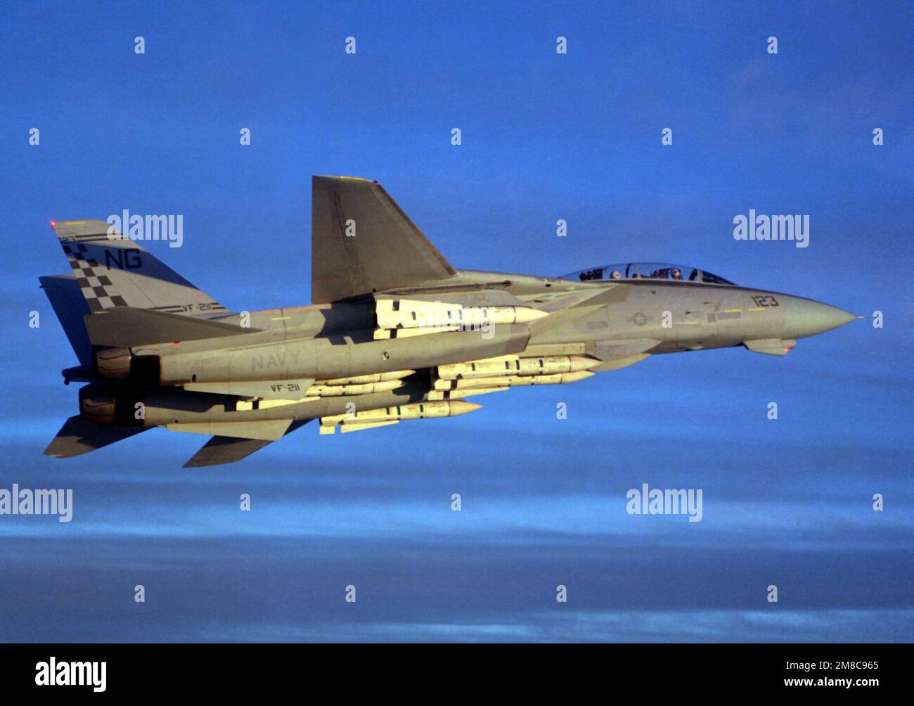 An air-to-air right underside view of a Fighter Squadron 211 (VF-211) F ...