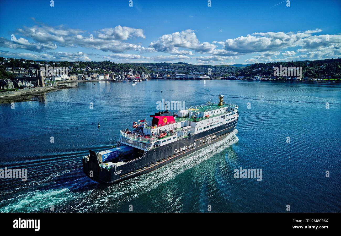 A ferry sails on calm seas at Oban Bay, Oban, Argyll, Scotland Stock ...