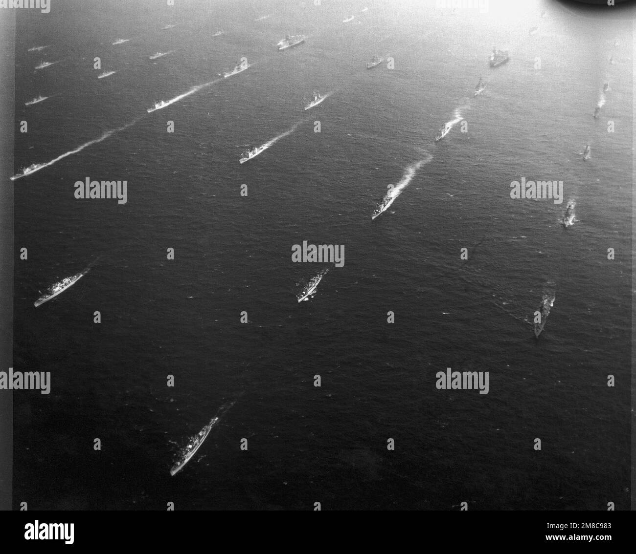 Copy image of an aerial view of US Navy (USN) and allied vessels ...