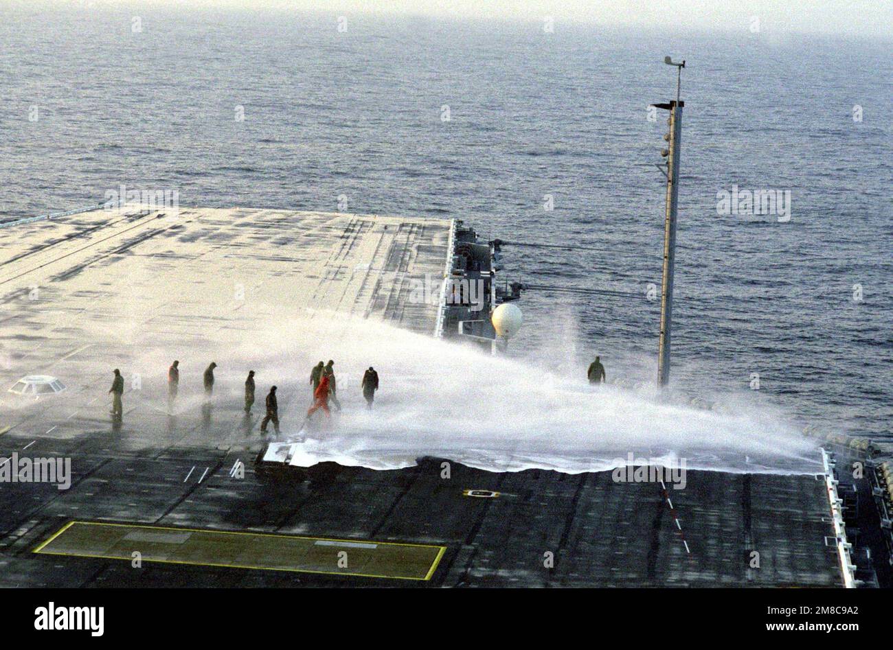 Crew members test the aqueous film forming foam firefighting on the ...