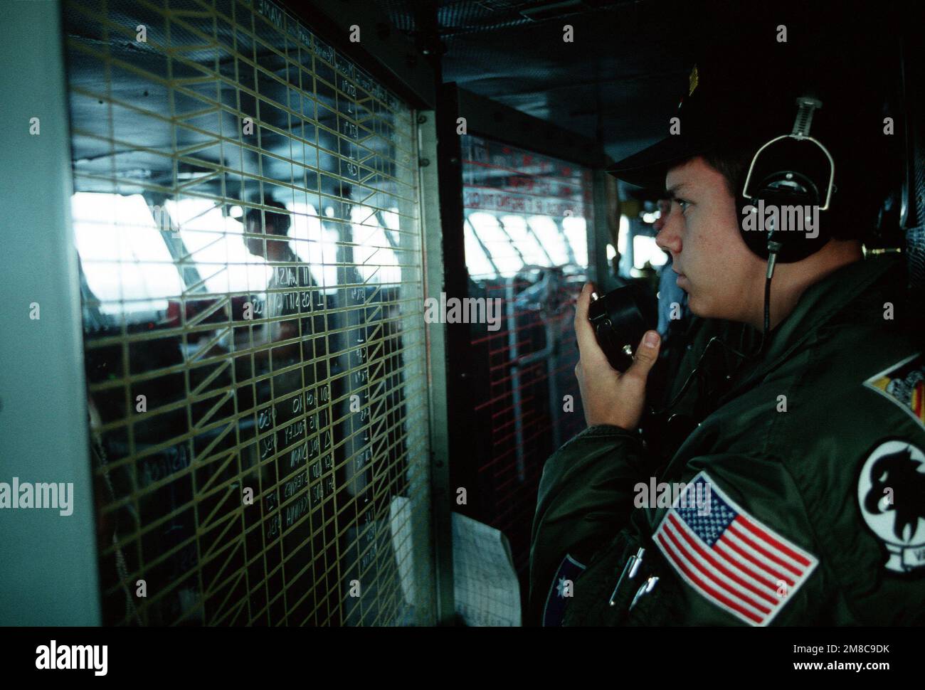A member of Airborne Early Warning Squadron 113 (VAW-113) works at a ...