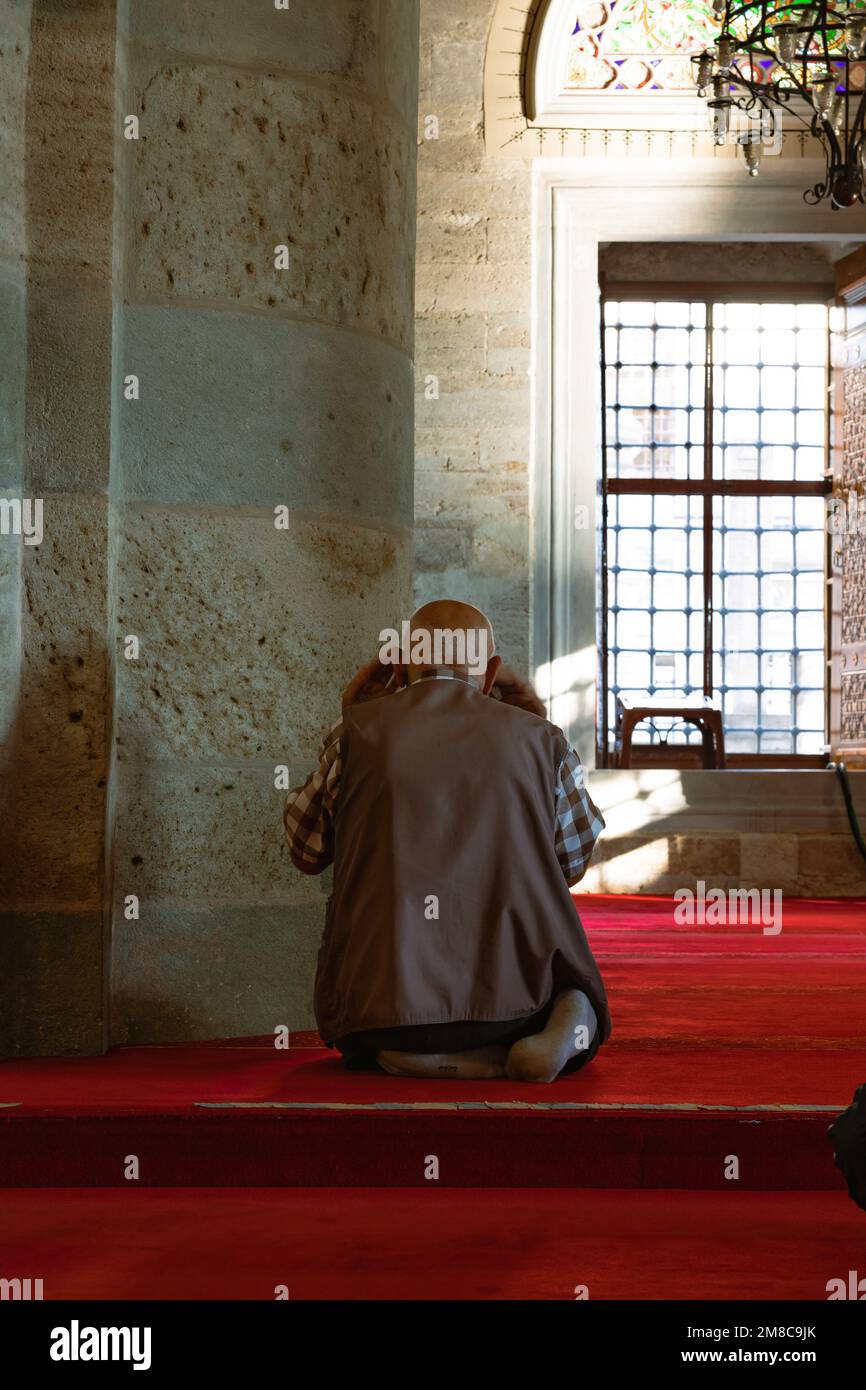 An elder muslim man praying in the mosque at daytime. Islamic concept ...