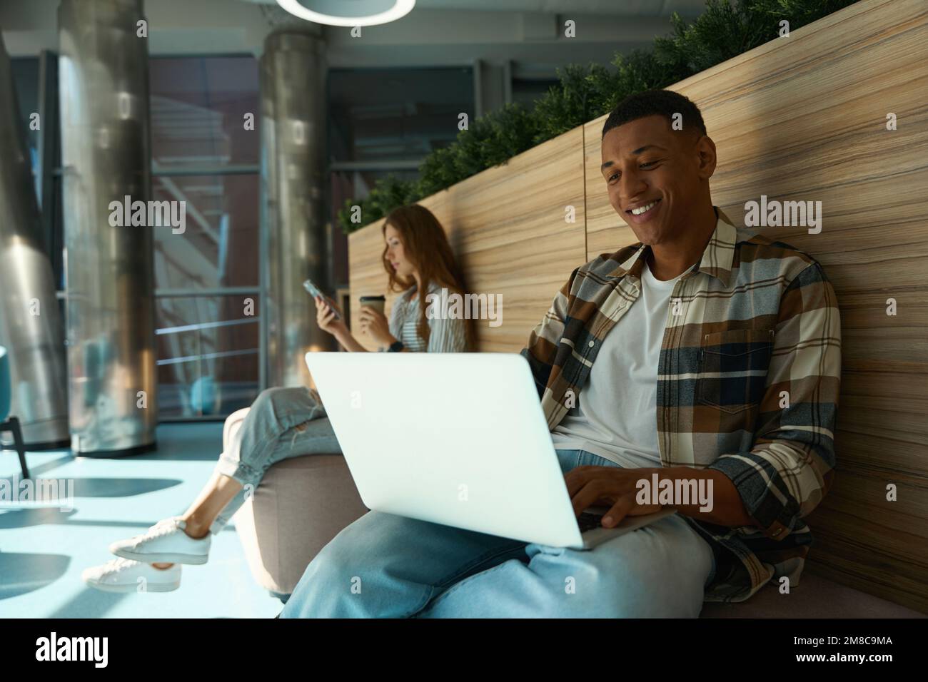 Collaborating office team typing hi-res stock photography and images ...