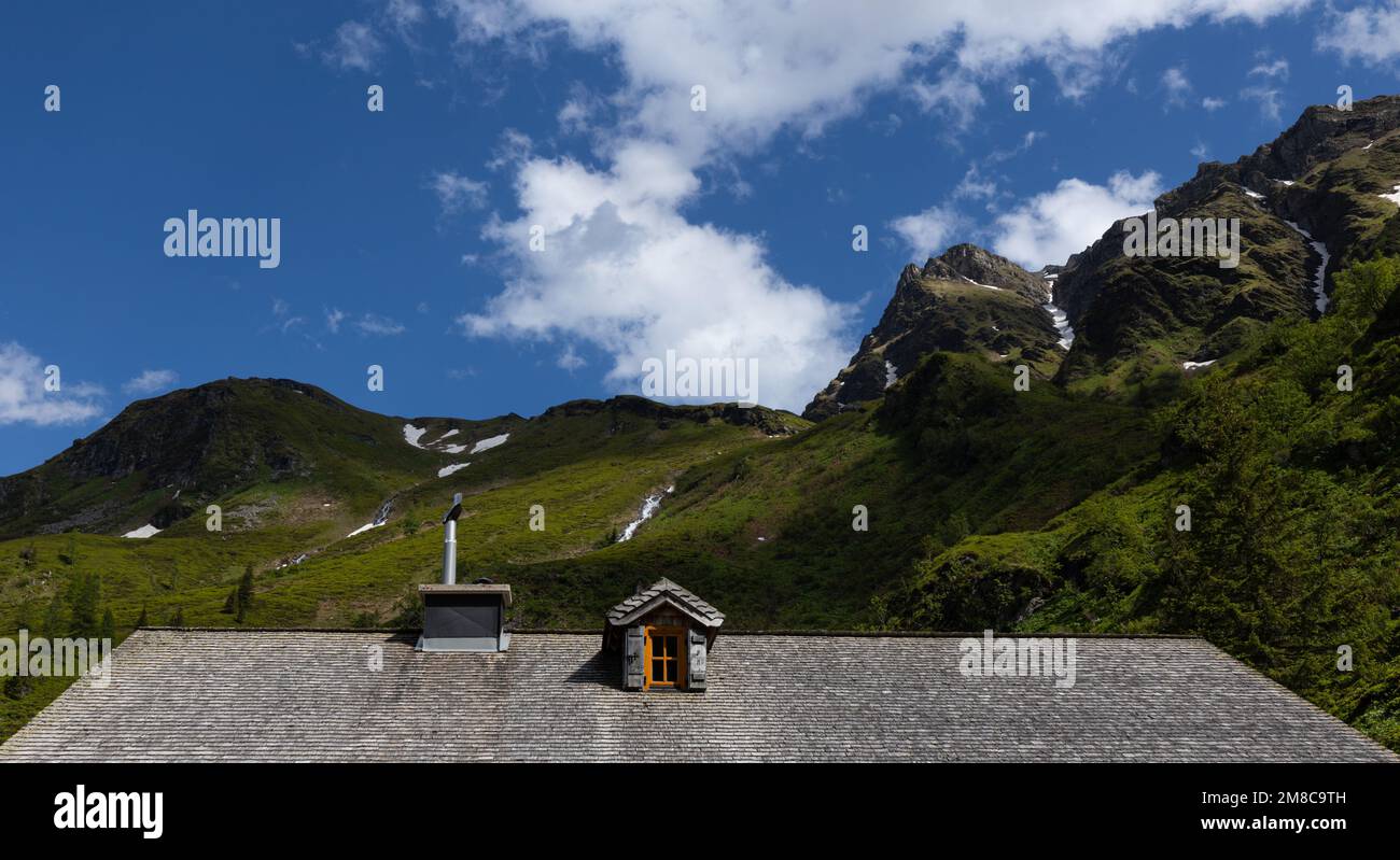 roof of a house in the mountains, alpine view, living in harmony with ...
