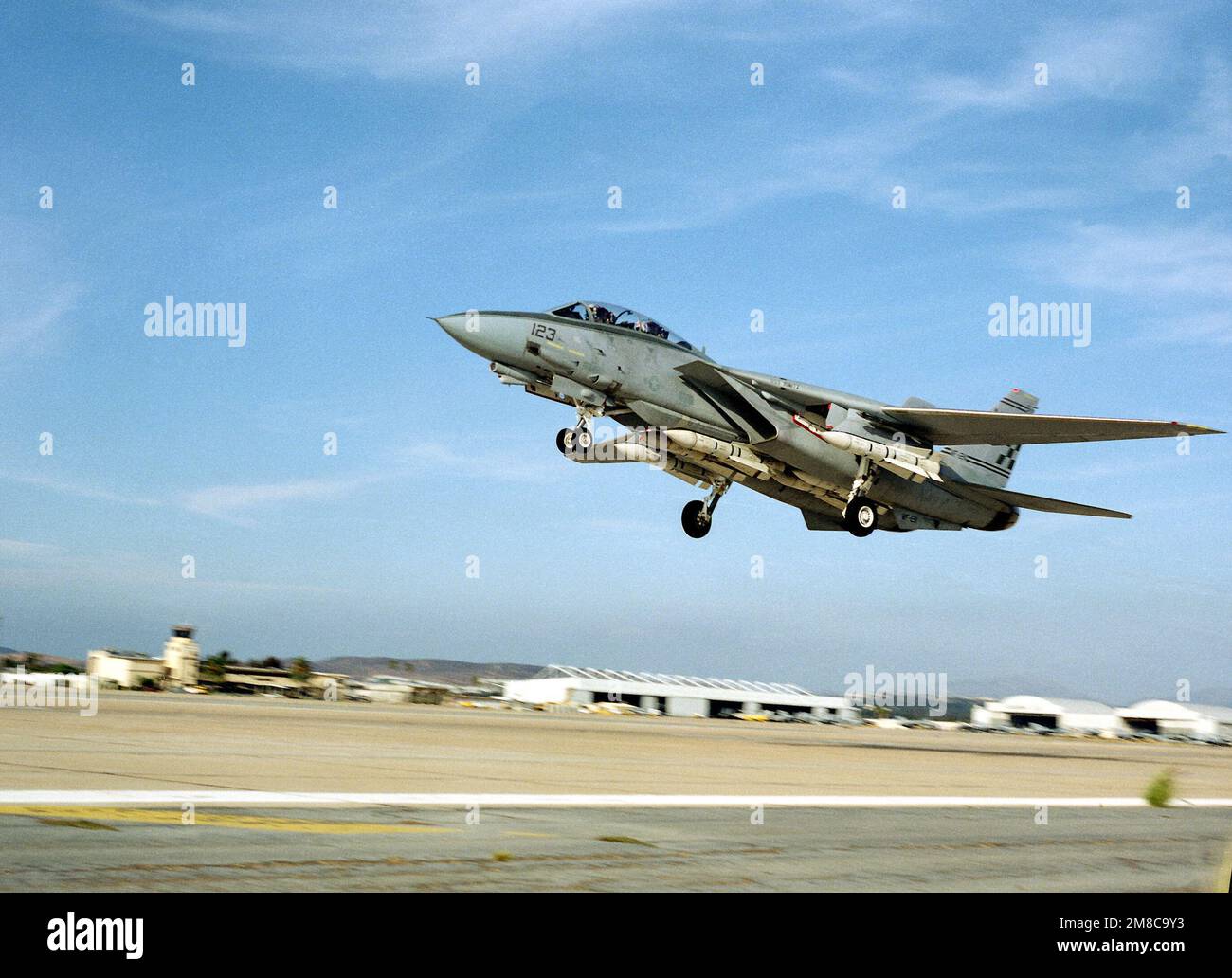 A Fighter Squadron 211 (VF-211) F-14A Tomcat armed with six AIM-54 Phoenix air-to-air missiles ...