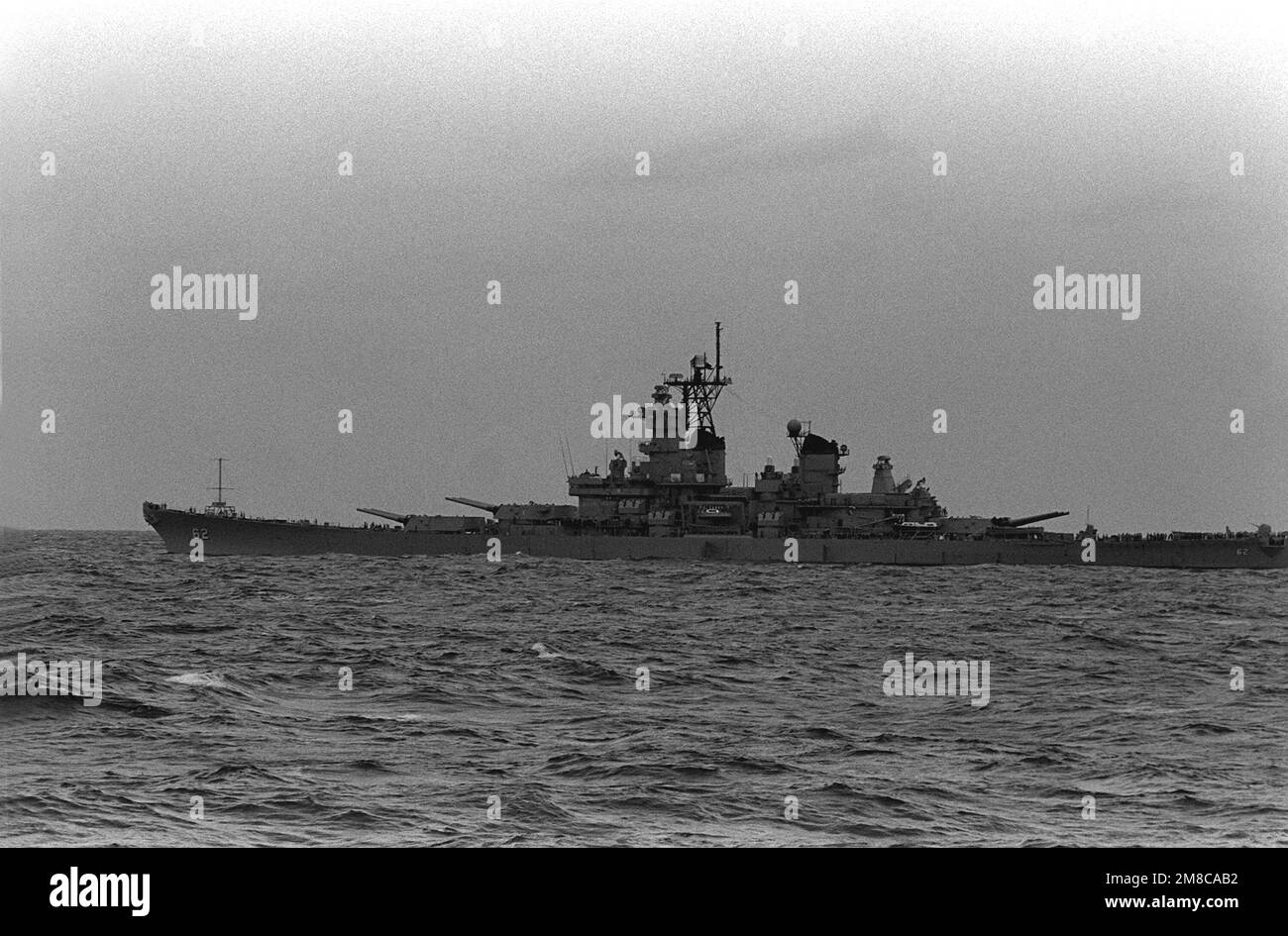 A port beam view of the battleship USS NEW JERSEY (BB-62) underway ...
