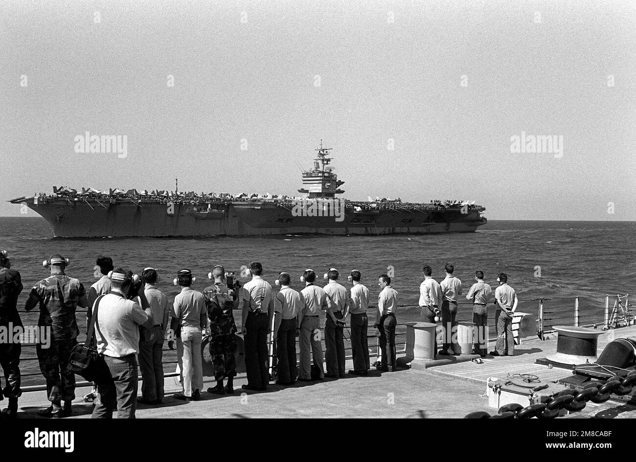 Crewmen line the deck of the battleship USS MISSOURI (BB-63) as the ...