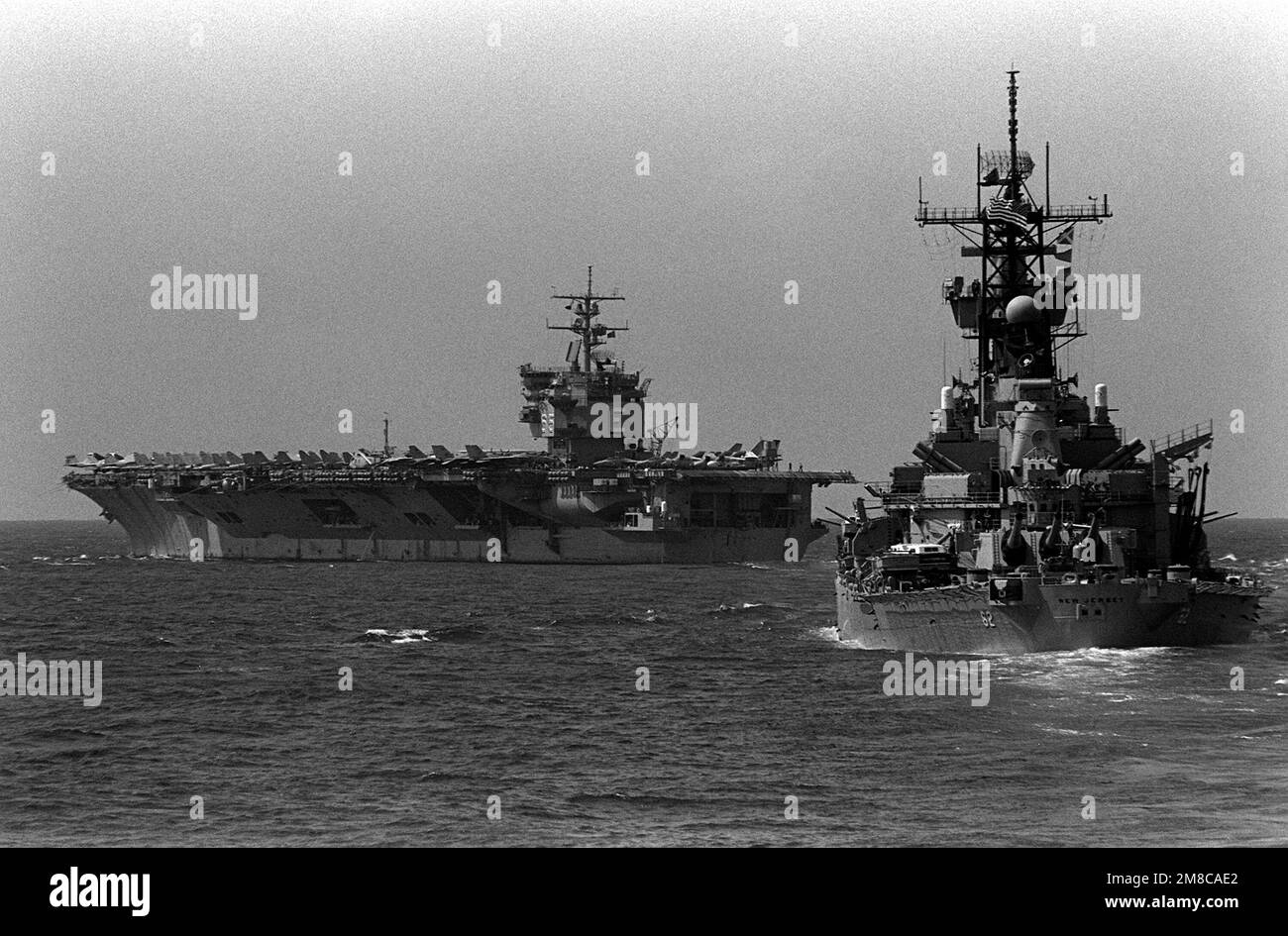 The battleship USS NEW JERSEY (BB-62) follows the nuclear-powered ...