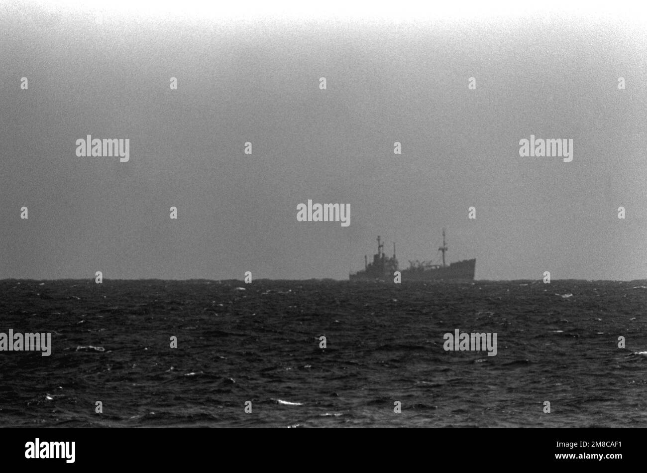 A starboard bow view of the target ship being fired at by the ...