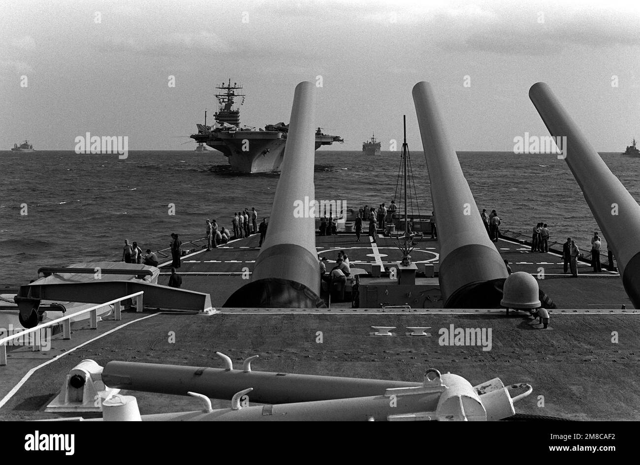 Crewmen relax on the stern of the battleship USS MISSOURI (BB-63 ...