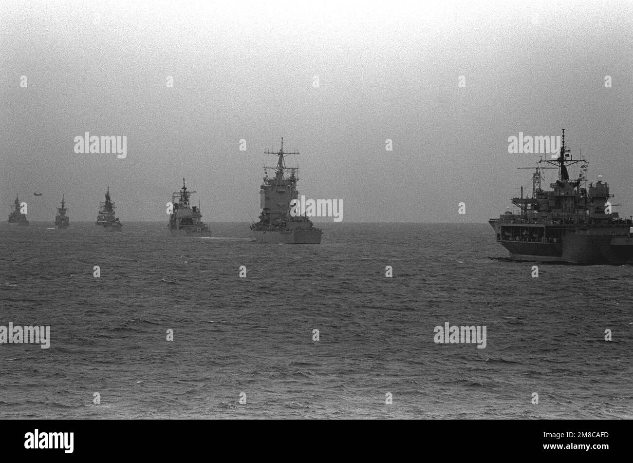 A line of ships sail in formation during Fleet Exercise '89. The ships ...