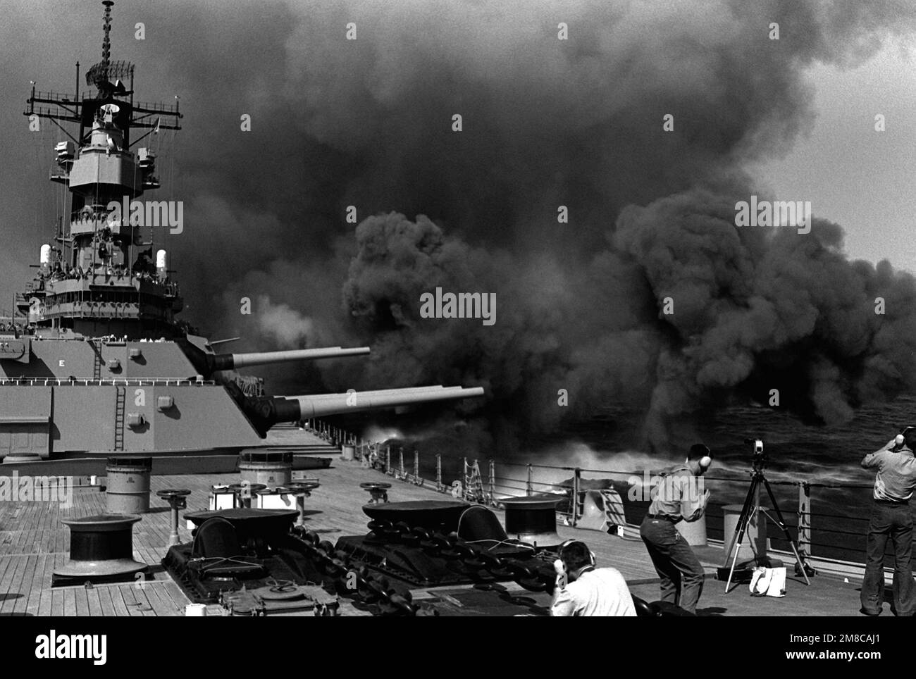 Smoke fills the air after the battleship USS MISSOURI (BB-63) fired a ...