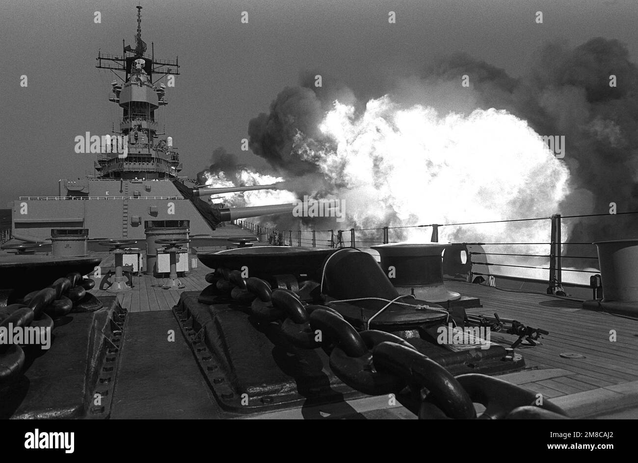 Smoke billows from the muzzles of the Mark 7 16-inch/50-caliber guns in ...