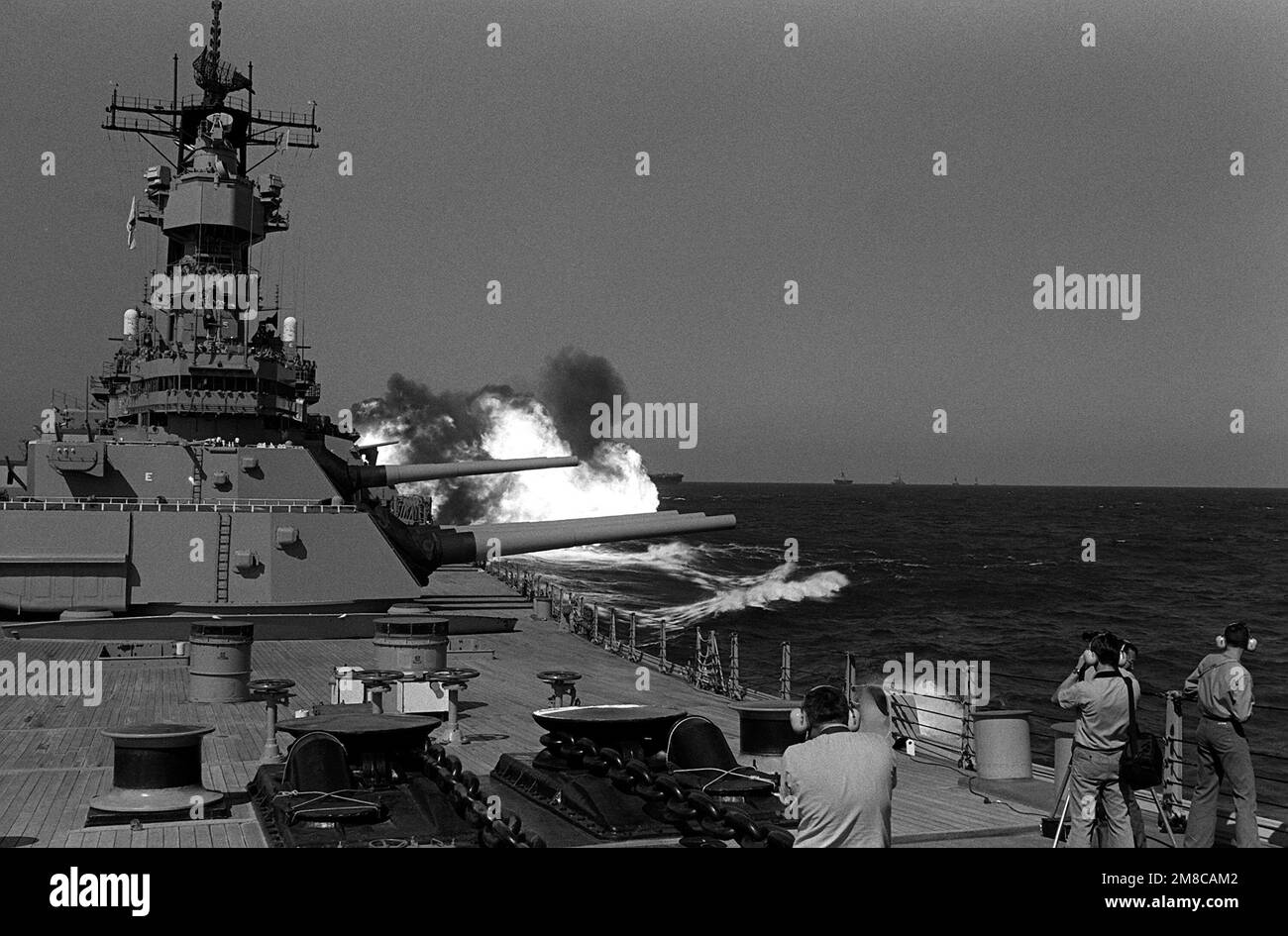 The battleship USS MISSOURI (BB-63) fires one of its Mark 7 16-inch/50 ...