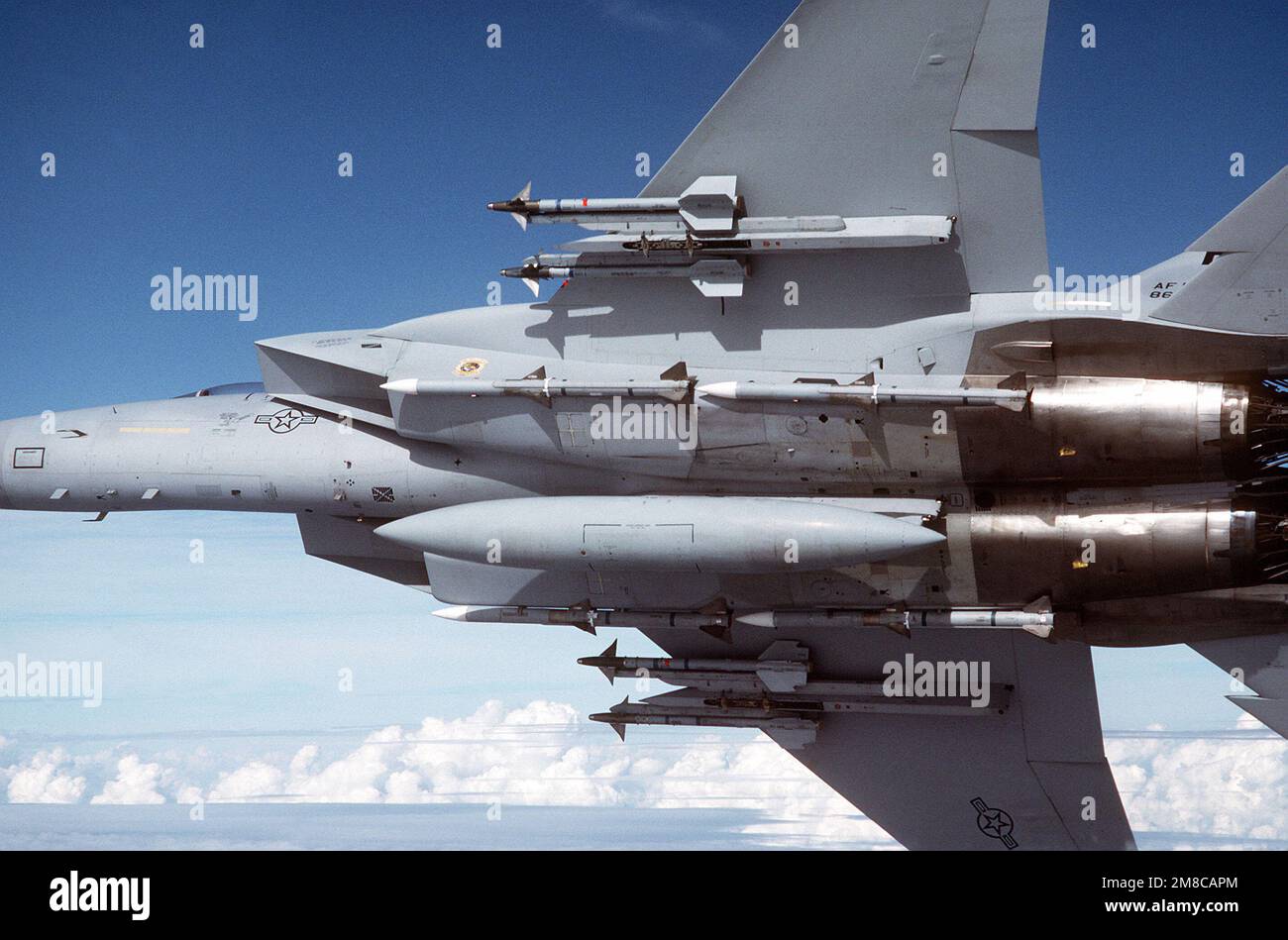 A close-up view of the bottom of a 33rd Tactical Fighter Wing F-15C ...