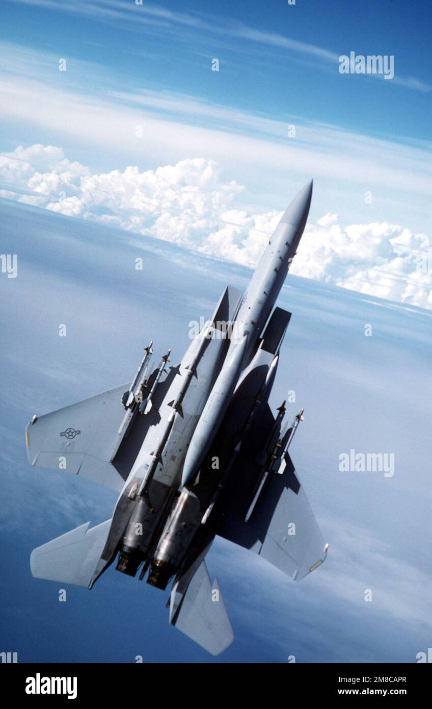 A 33rd Tactical Fighter Wing F-15C Eagle aircraft pulls into a climb ...