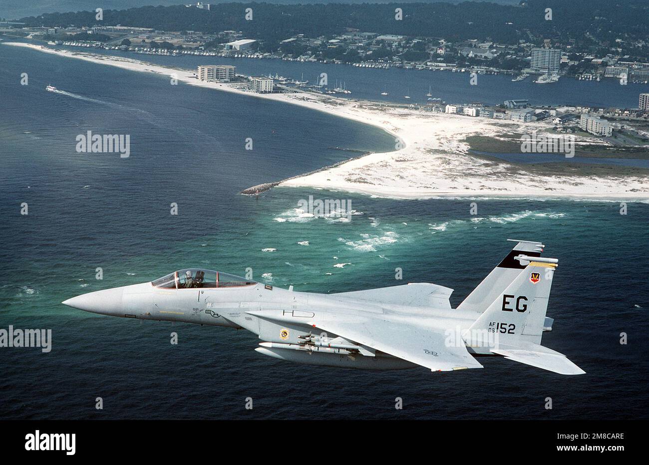 A 33rd Tactical Fighter Wing F-15C Eagle aircraft passes along the ...