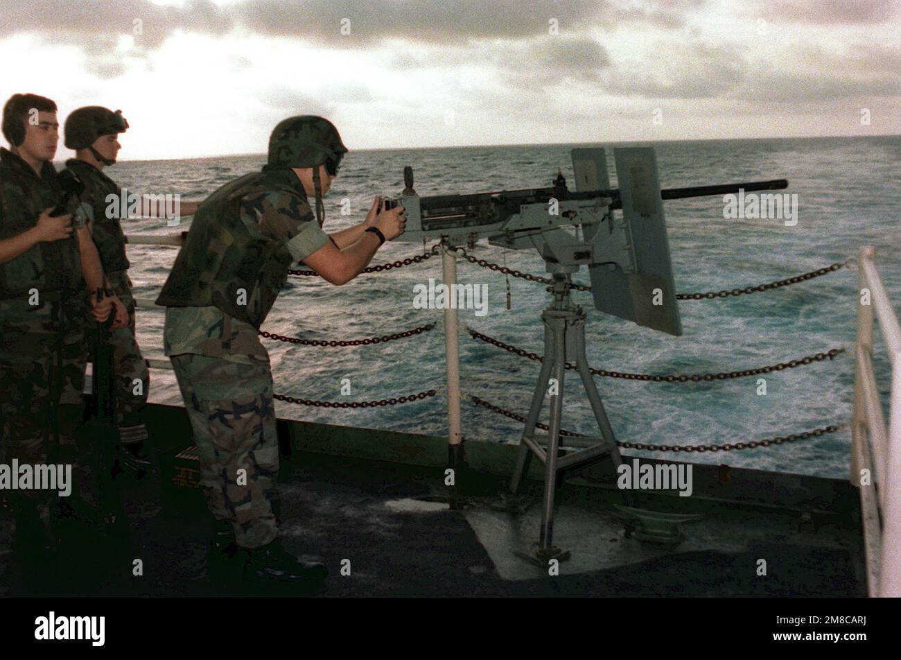 A security force team member fires an M60 .50-caliber machine gun ...