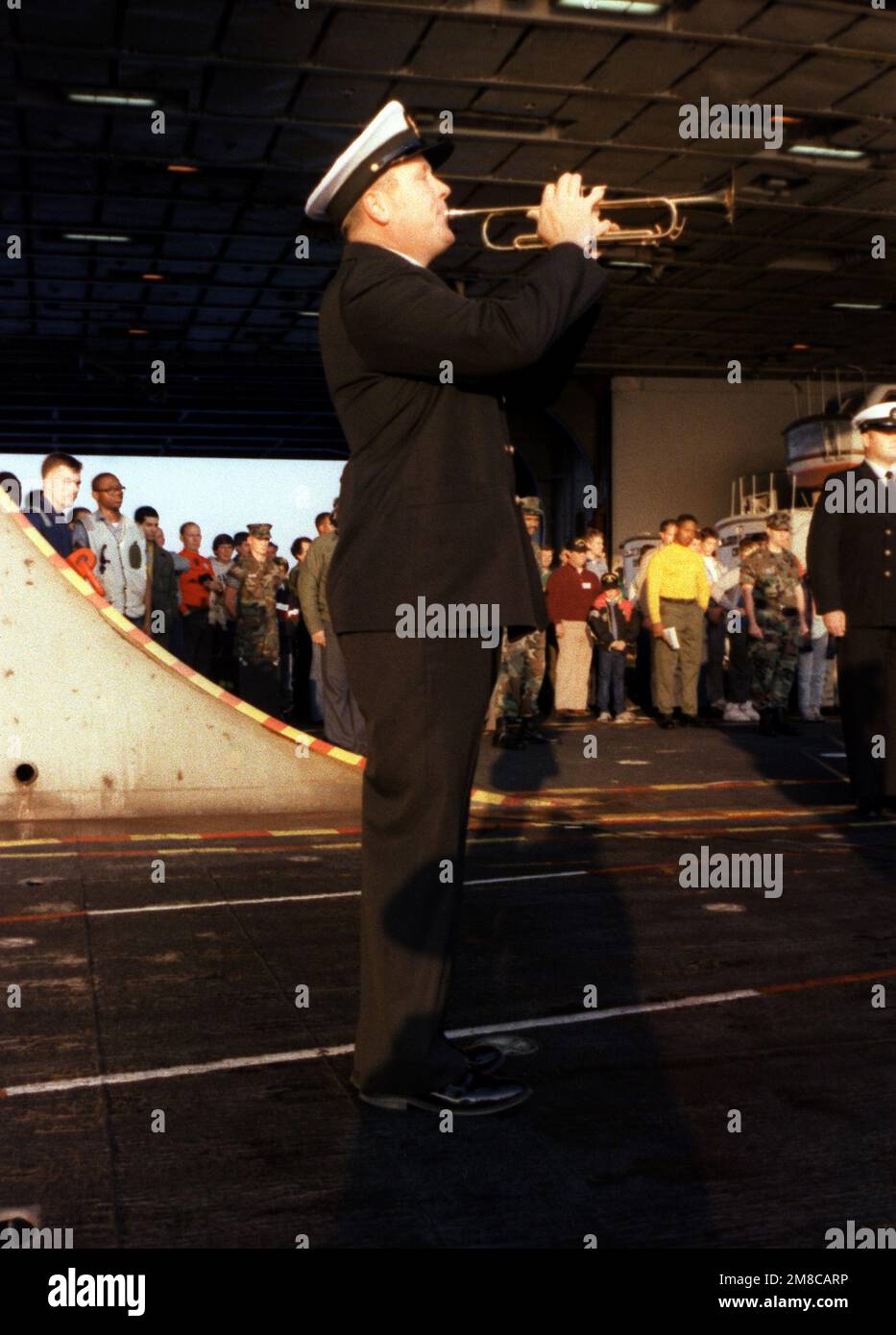 SENIOR CHIEF Aircrew Survival Equipmentman Joseph Walck plays Taps ...