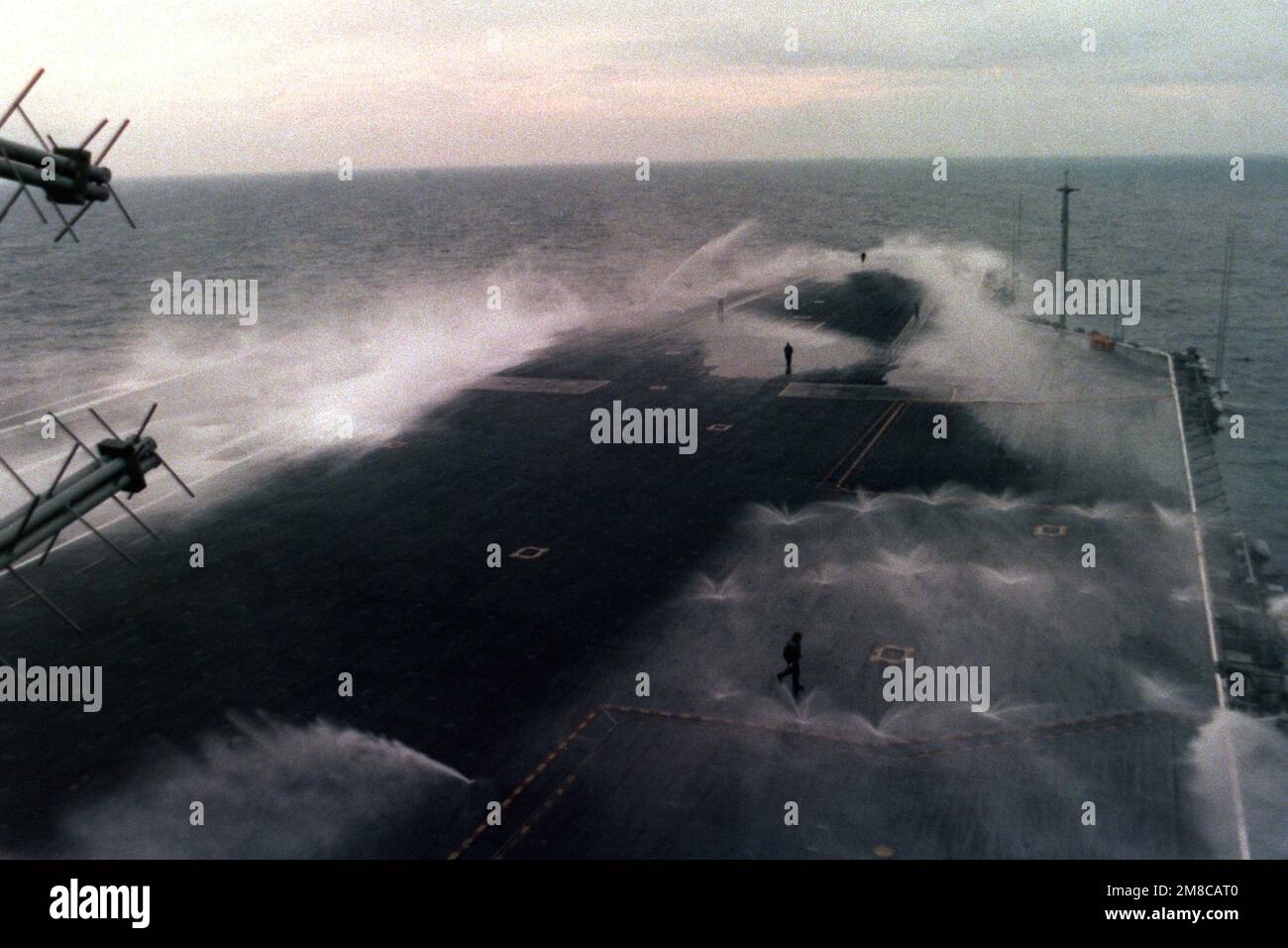 The flight deck water washdown system is tested aboard the aircraft ...