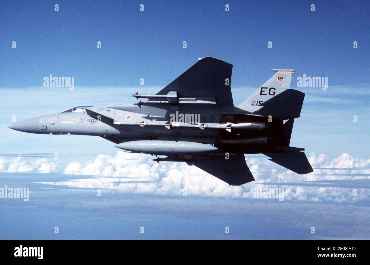 A 33rd Tactical Fighter Wing F-15C Eagle aircraft banks into a turn ...