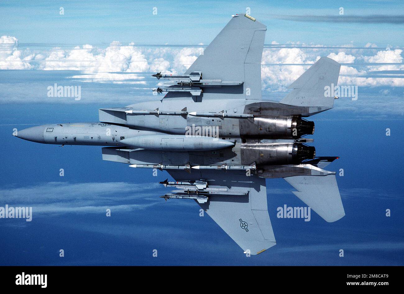 A 33rd Tactical Fighter Wing F-15C Eagle aircraft banks into a turn ...