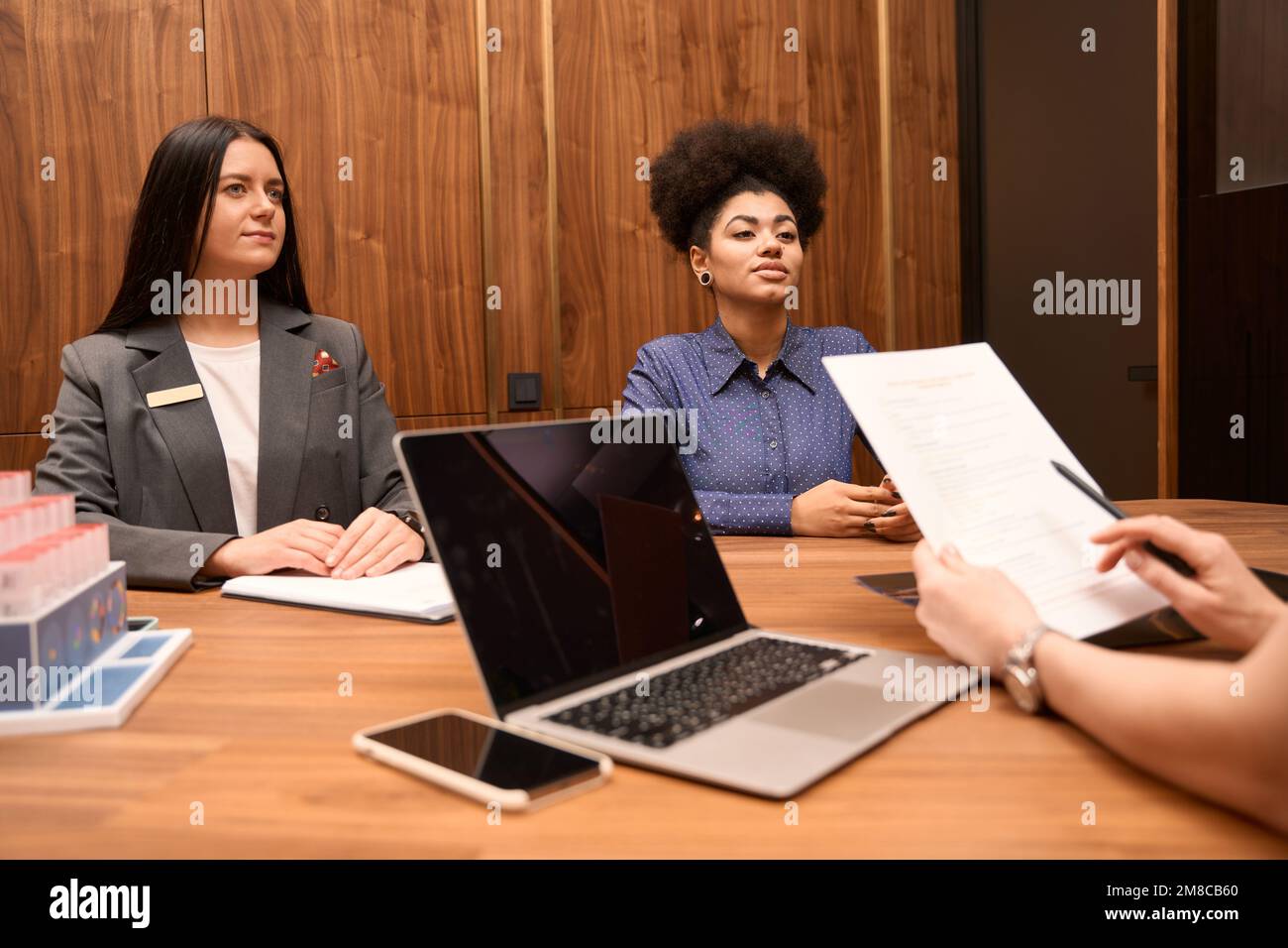 Administrator and client at consultation with doctor Stock Photo - Alamy