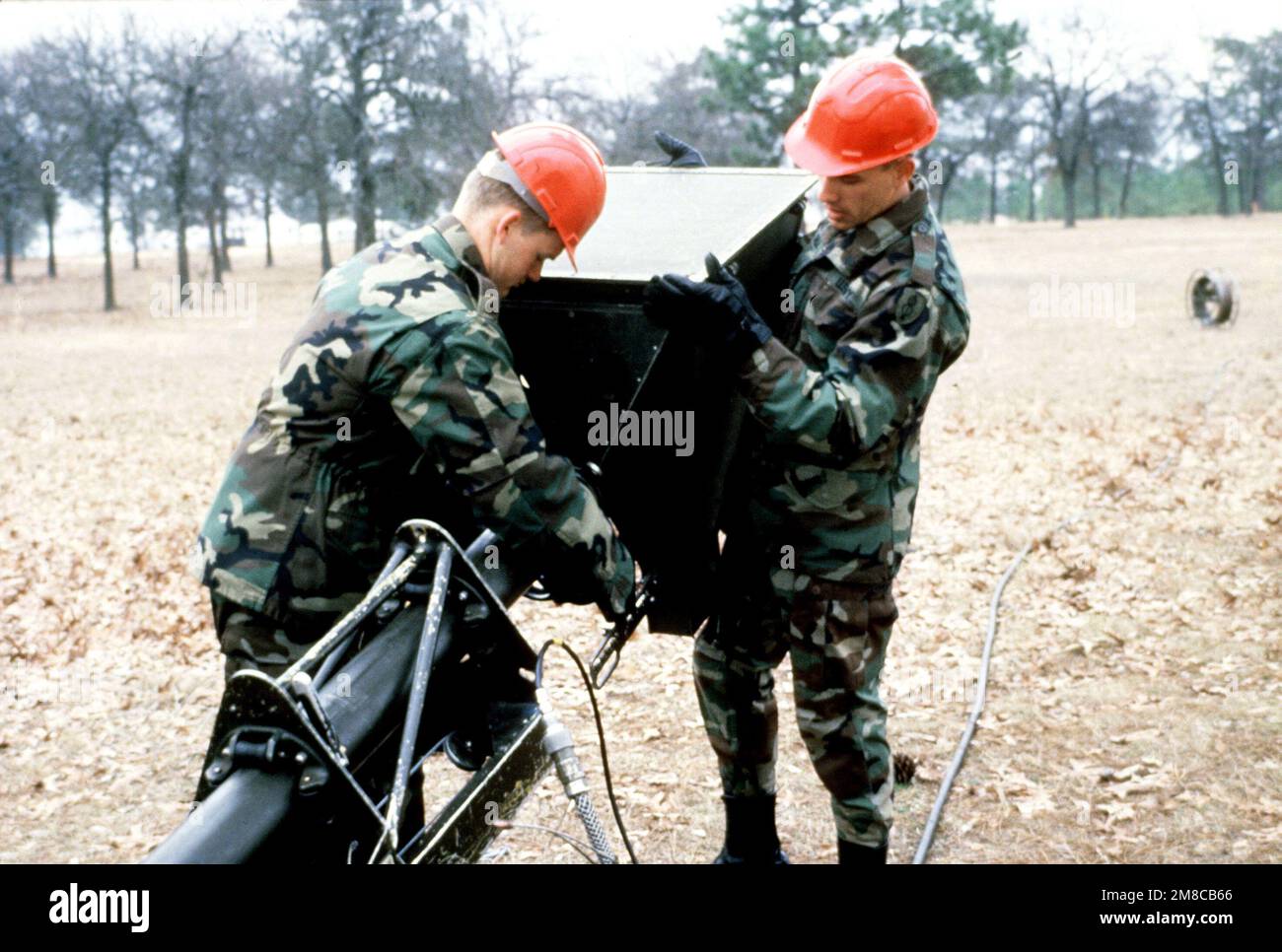 Two students set up an AB-577 antenna tower during their training at ...