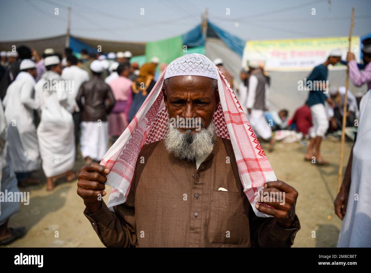 A Muslim devotee attending the Bishwa Ijtema at Tongi poses for a photo ...