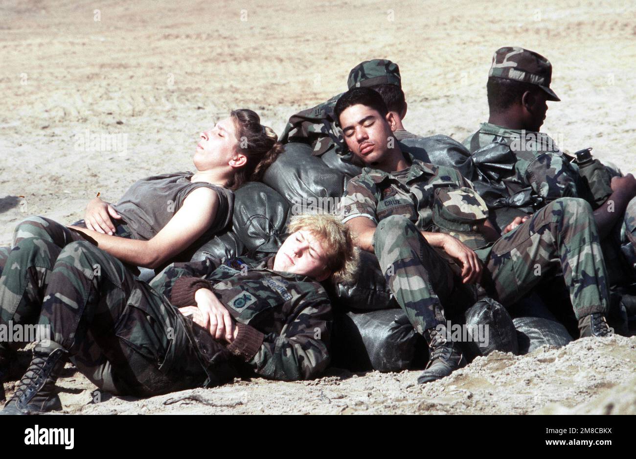 Members of a security police unit take a break during the air base ...