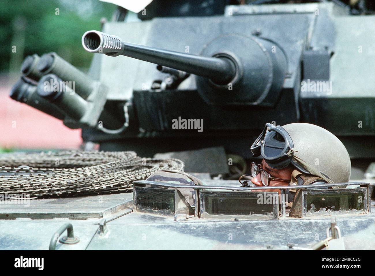 The driver of a Marine LAV25 light armored vehicle peers out from his ...