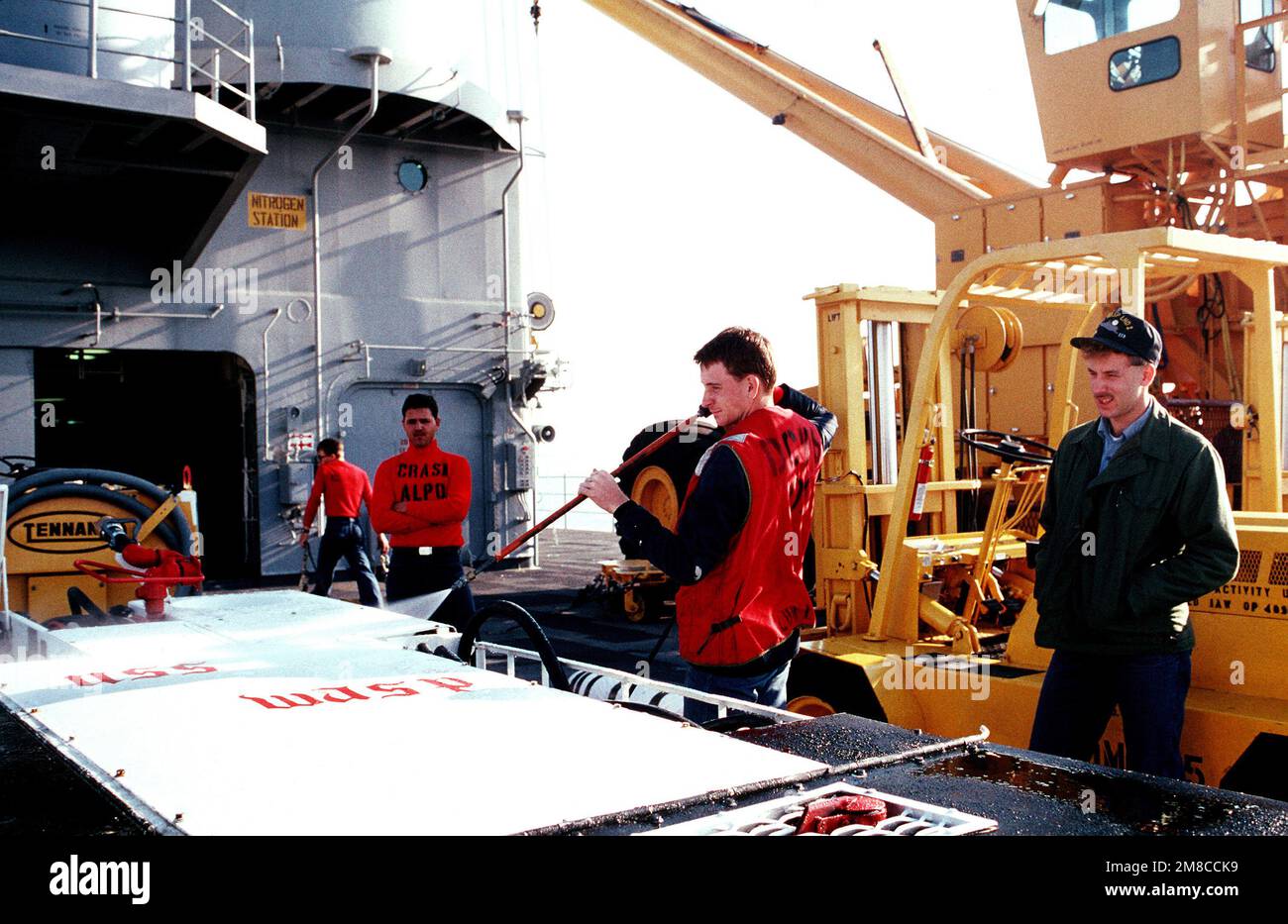 A member of the flight deck crash crew aboard the amphibious assault ...