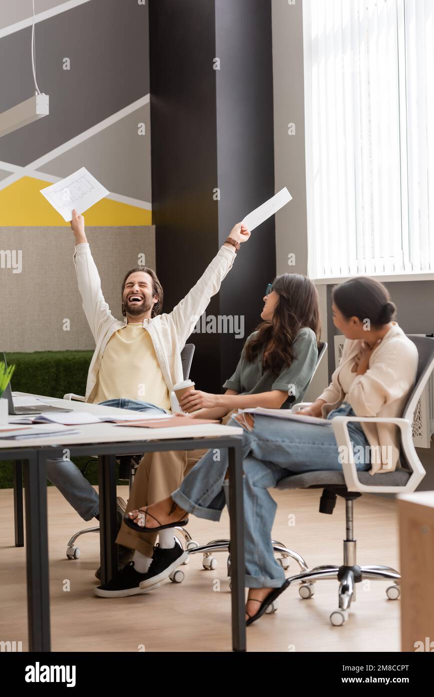 Documents blueprint teamwork hands hi-res stock photography and images ...