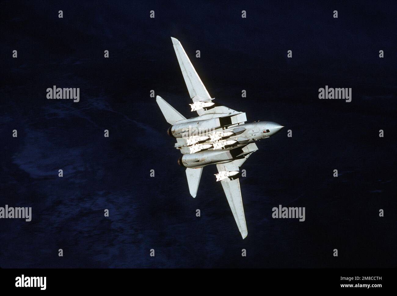 An underside view of a Fighter Squadron 211 (VF-211) F-14A Tomcat ...
