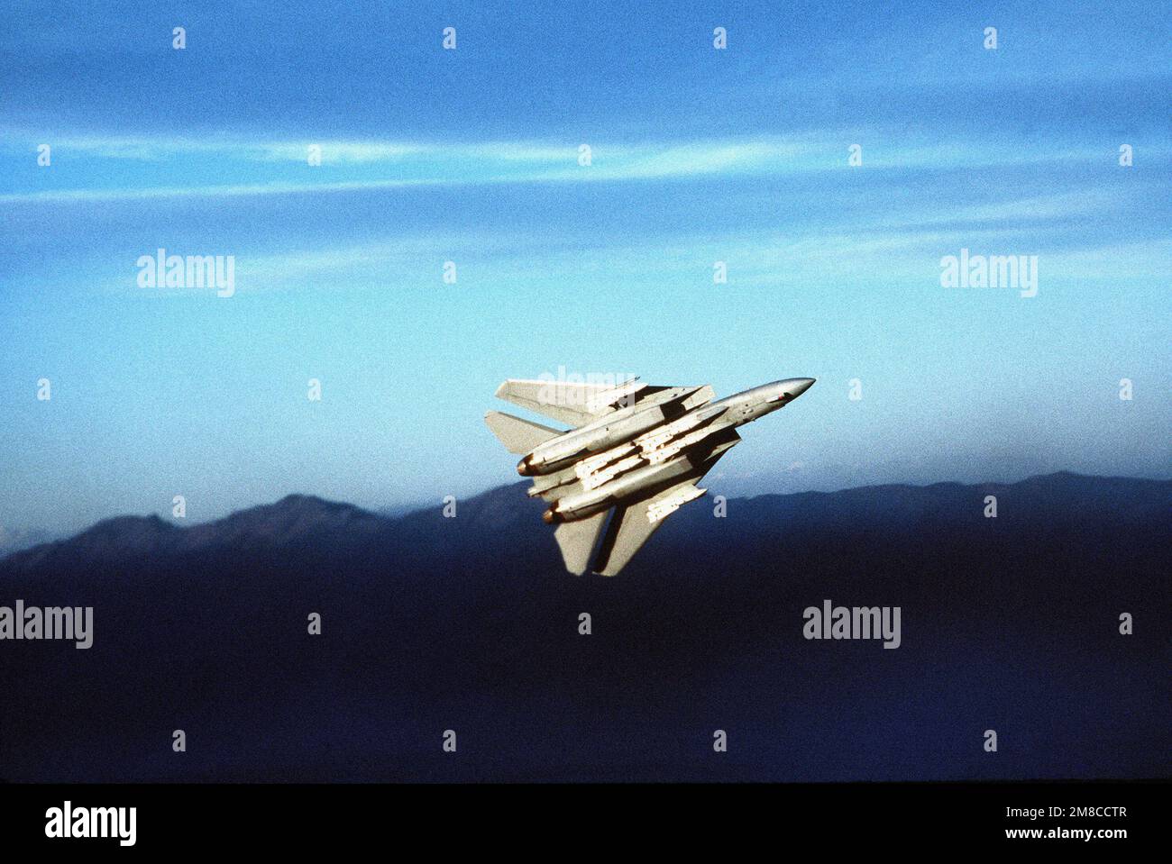 An underside view of a Fighter Squadron 211 (VF-211) F-14A Tomcat ...