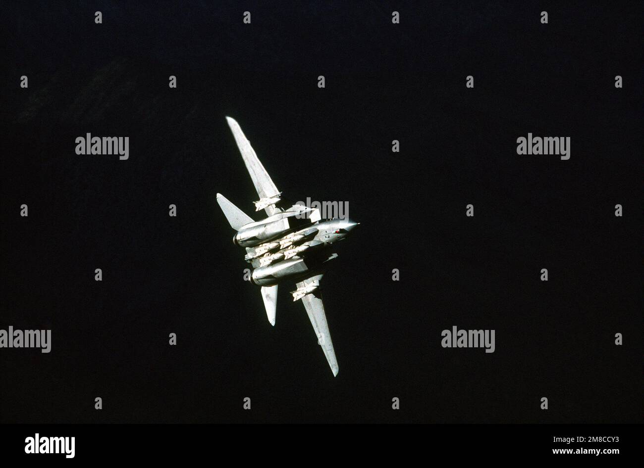 An underside view of a Fighter Squadron 211 (VF-211) F-14A Tomcat ...