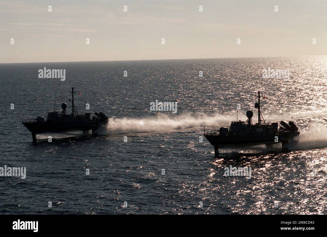 The patrol combatant missile hydrofoils USS TAURUS (PHM 3), left, and ...
