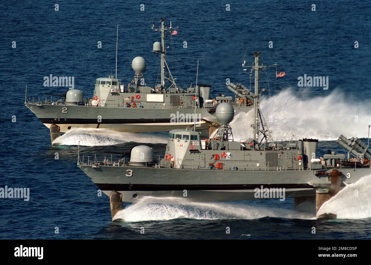 The patrol combatant missile hydrofoils USS TAURUS (PHM-3), foreground ...