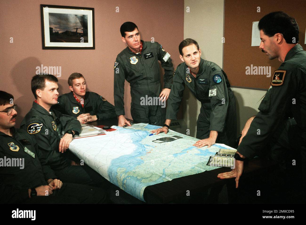 CPT Mike Pompoco, right, briefs the crew of a 69th Bomb Squadron B-52 ...