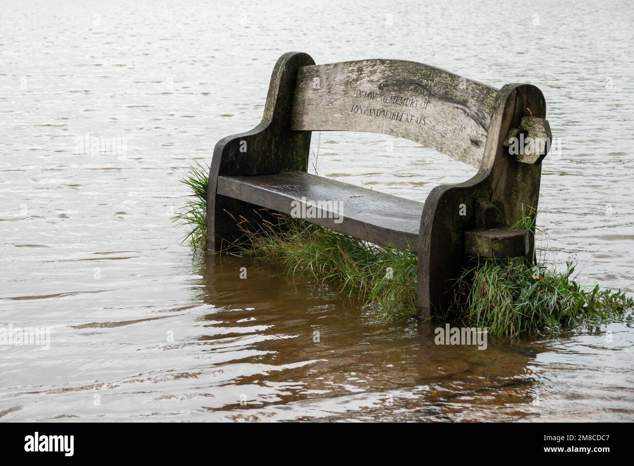 bench surround by water at high tide in the River Hamble Country Park ...