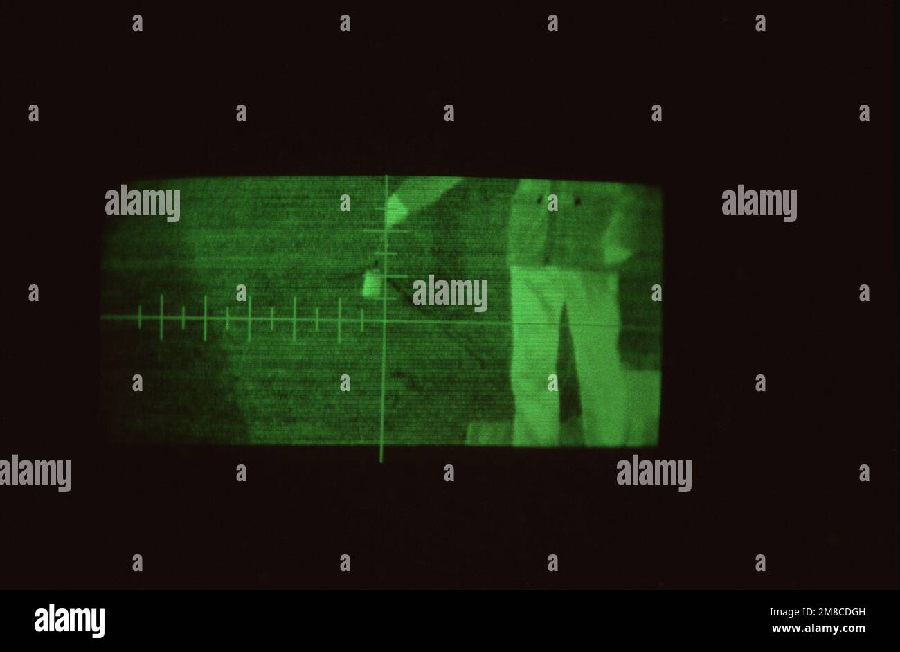 As seen through an AN/TAS-6 long-range night observation device, a man ...