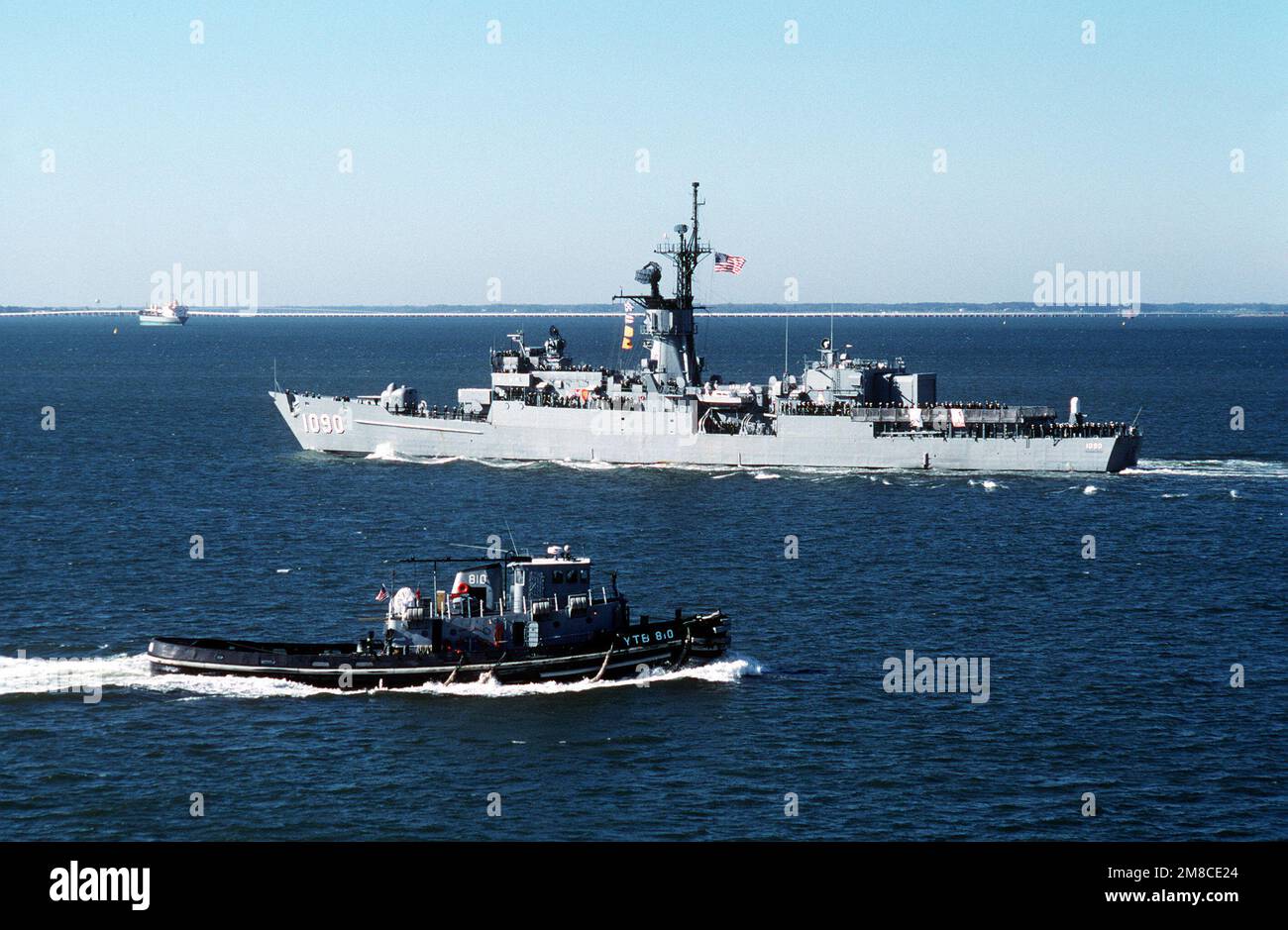 The large harbor tug ANOKA (YTB-810) and the frigate USS AINSWORTH (FF ...