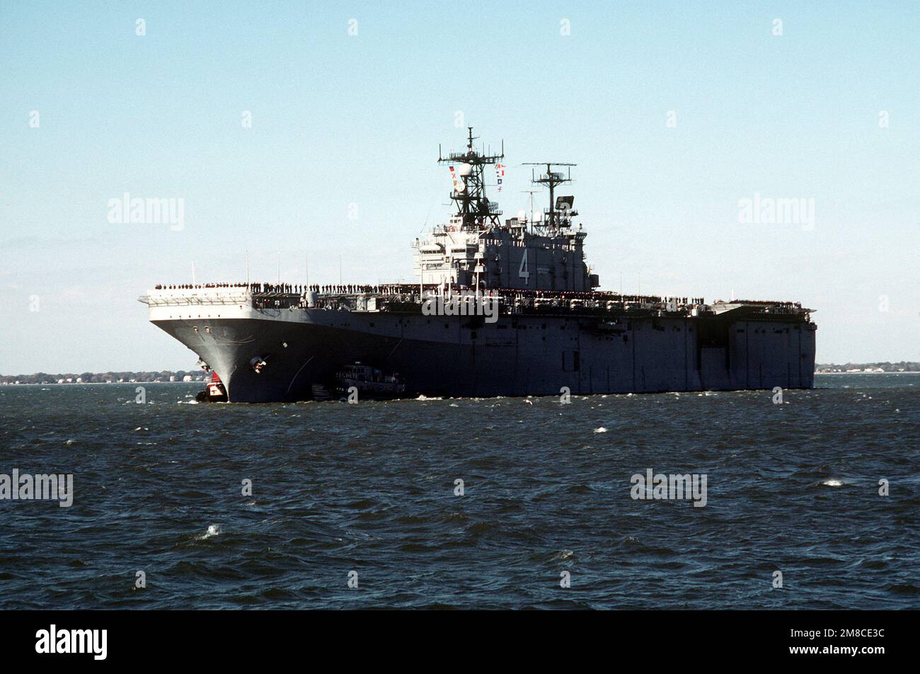 The large harbor tug MARINETTE (YTB-791) and another tug help the ...