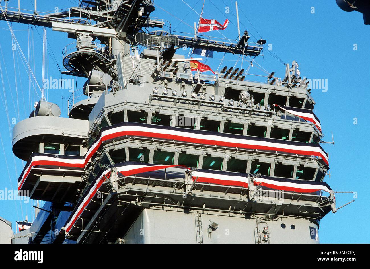 Bunting decks the island of the nuclear-powered aircraft carrier USS ...