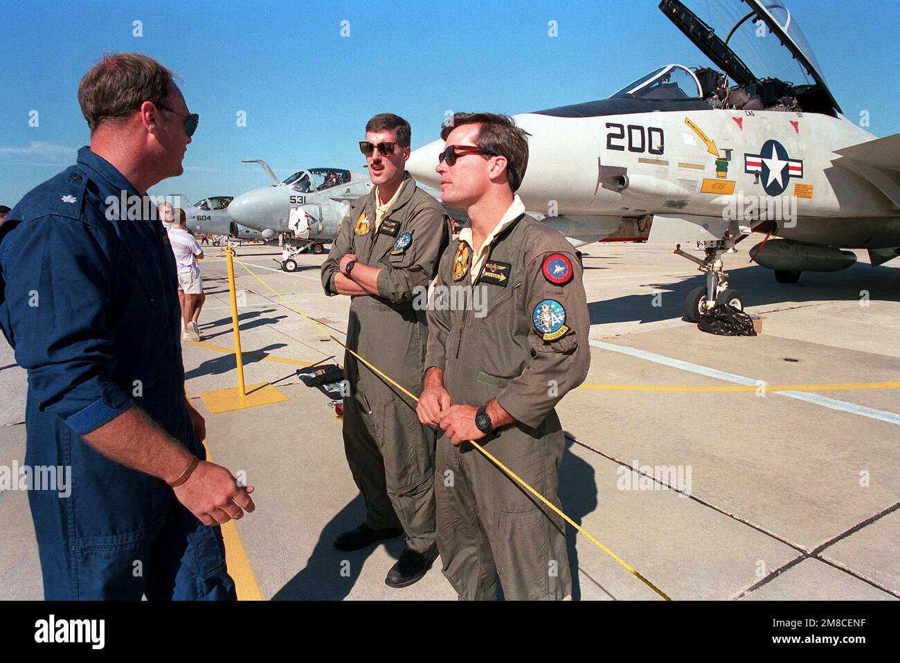 Members of Fighter Squadron 103 (VF-103) converse during the station's annual open house and air ...