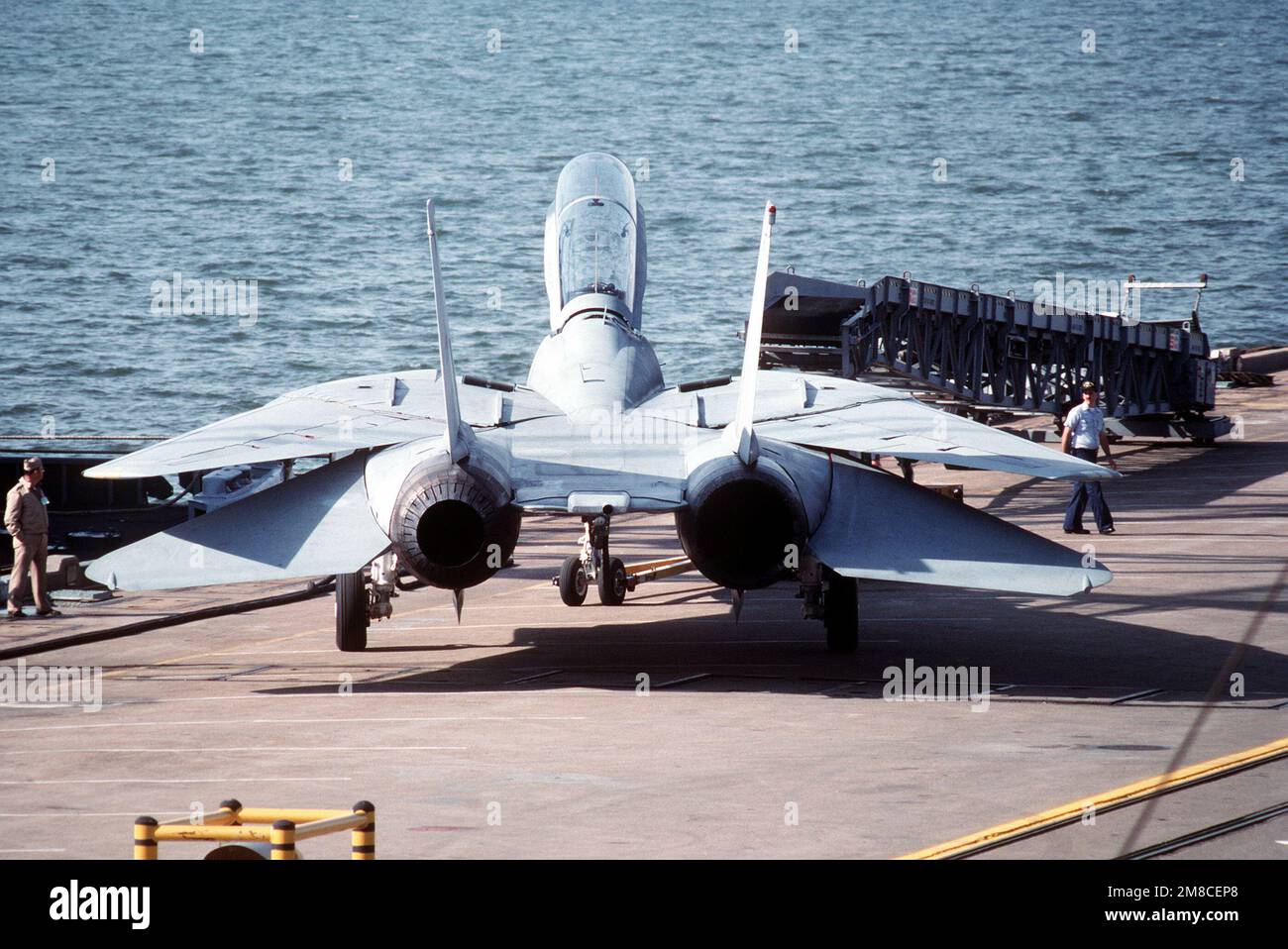 A Fighter Squadron 41 (VF-41) F-14A Tomcat aircraft is moved along Pier ...