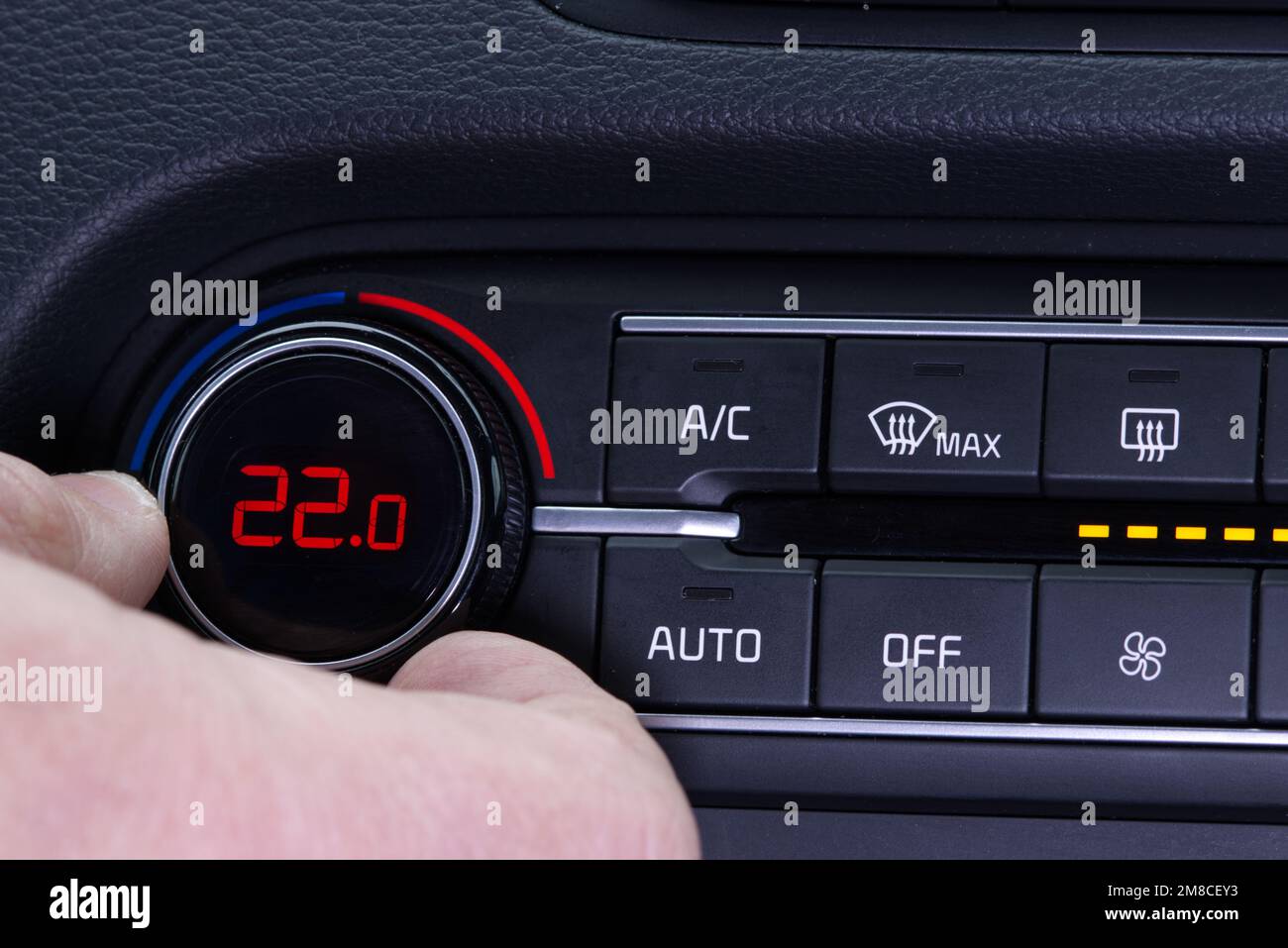 Set up air conditioner in the car. Hand turns air conditioner ring ...