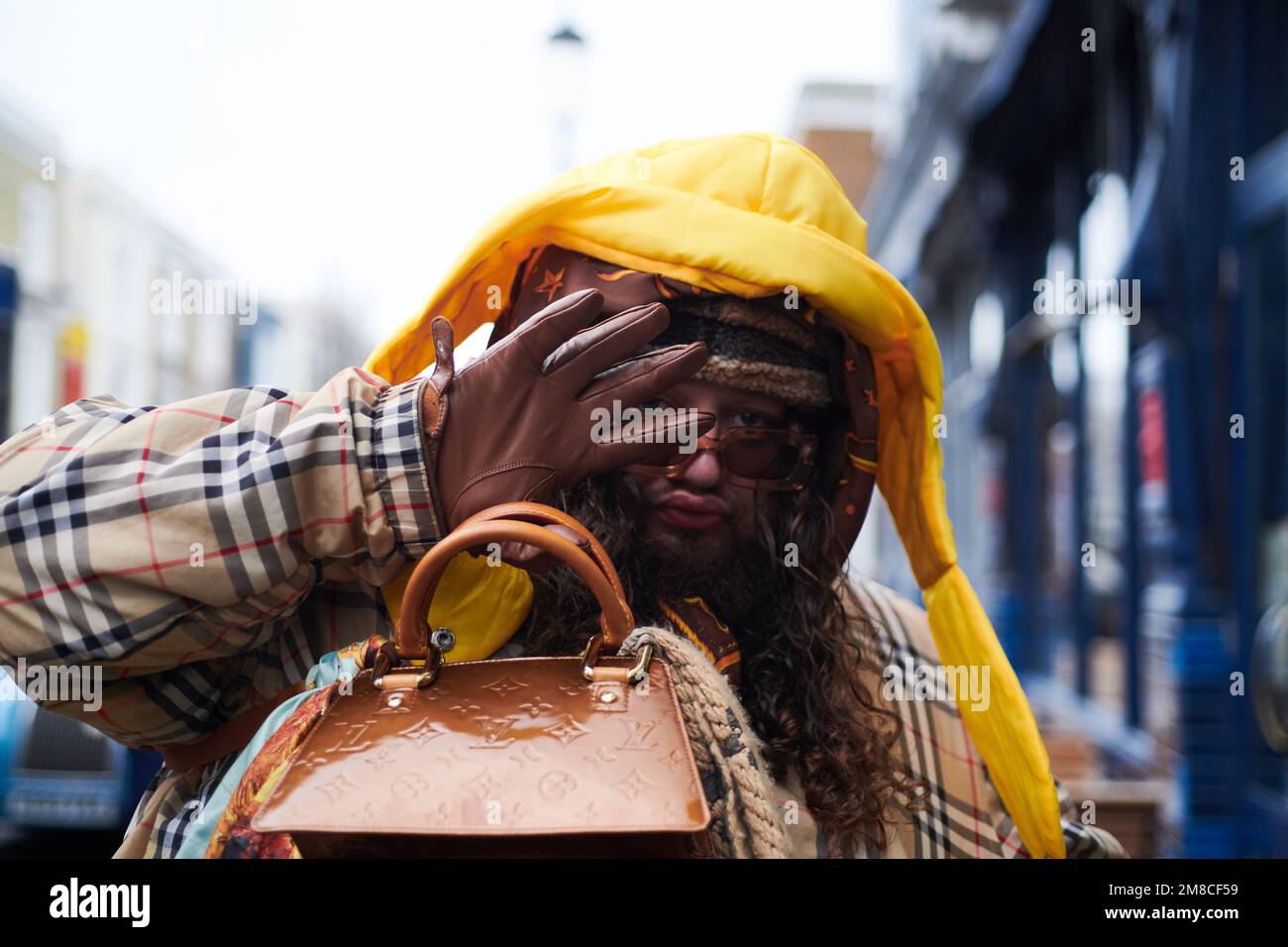 Portrait of a funky branded man in the streets around Portobello Market ...